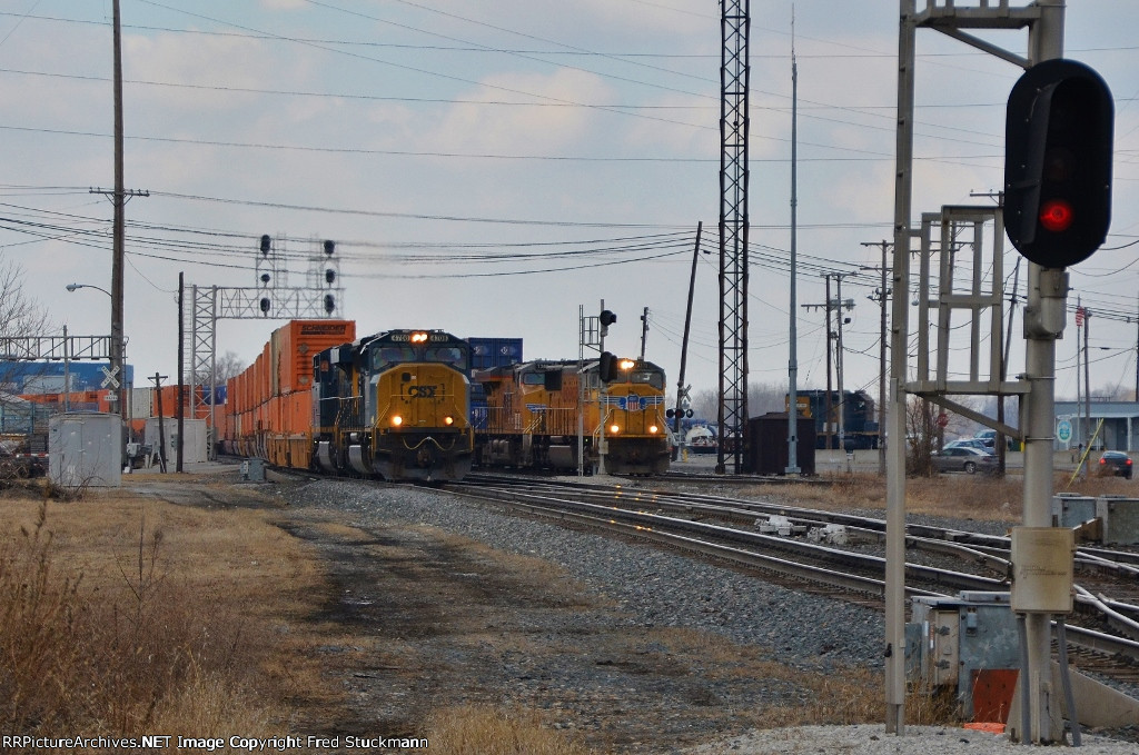 CSX 4708 & UP 4375 both out run the off duty yard engine in the distance.